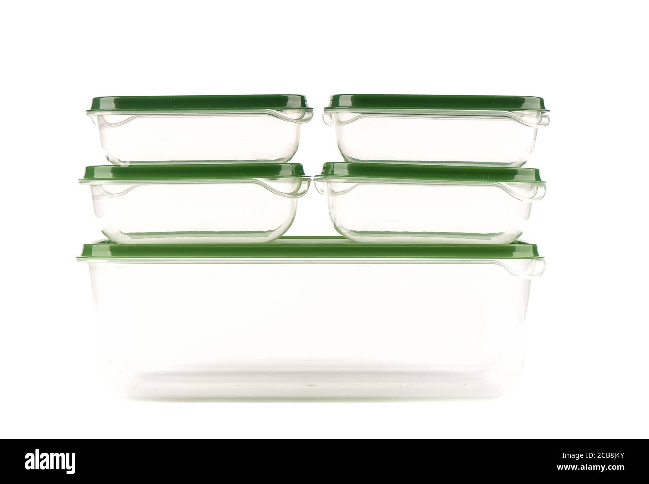 Plastic containers of different sizes with green lids for storing food ...