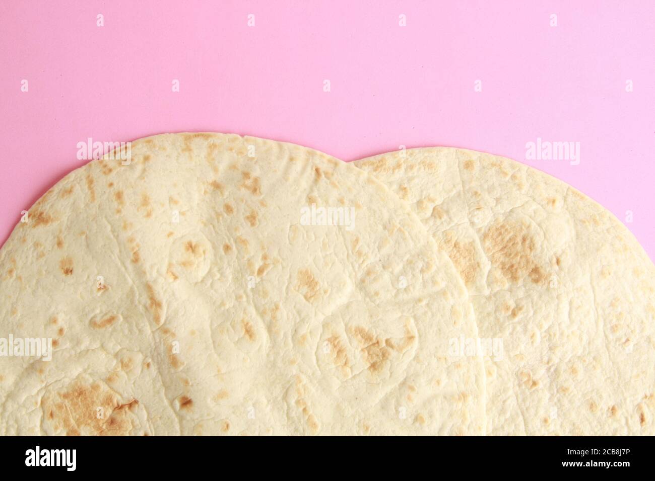 Top view of Mexican tortillas under the lights on a pink surface Stock ...