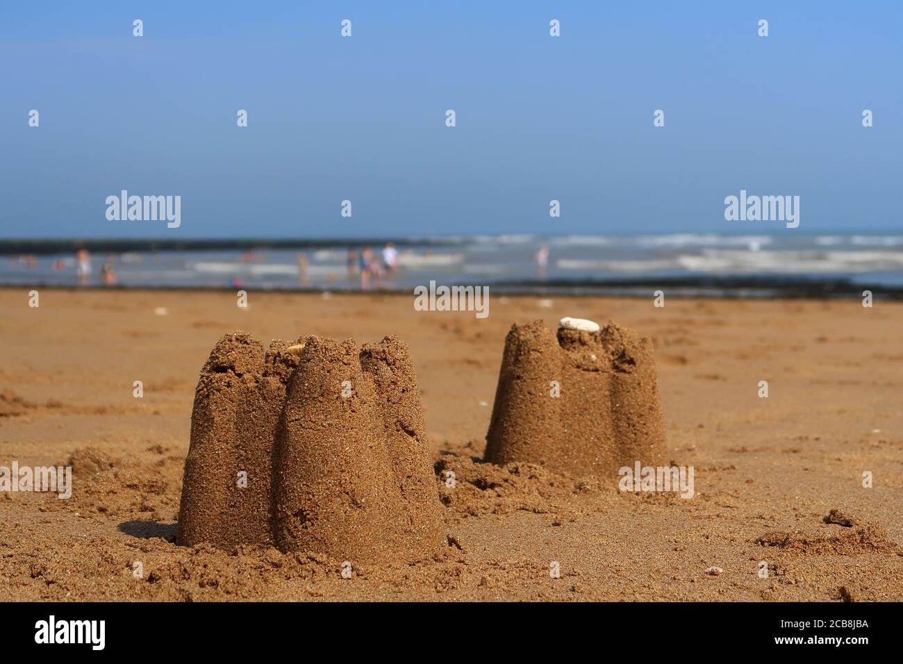 A still life scene on the beach with a sand castle Stock Photo - Alamy