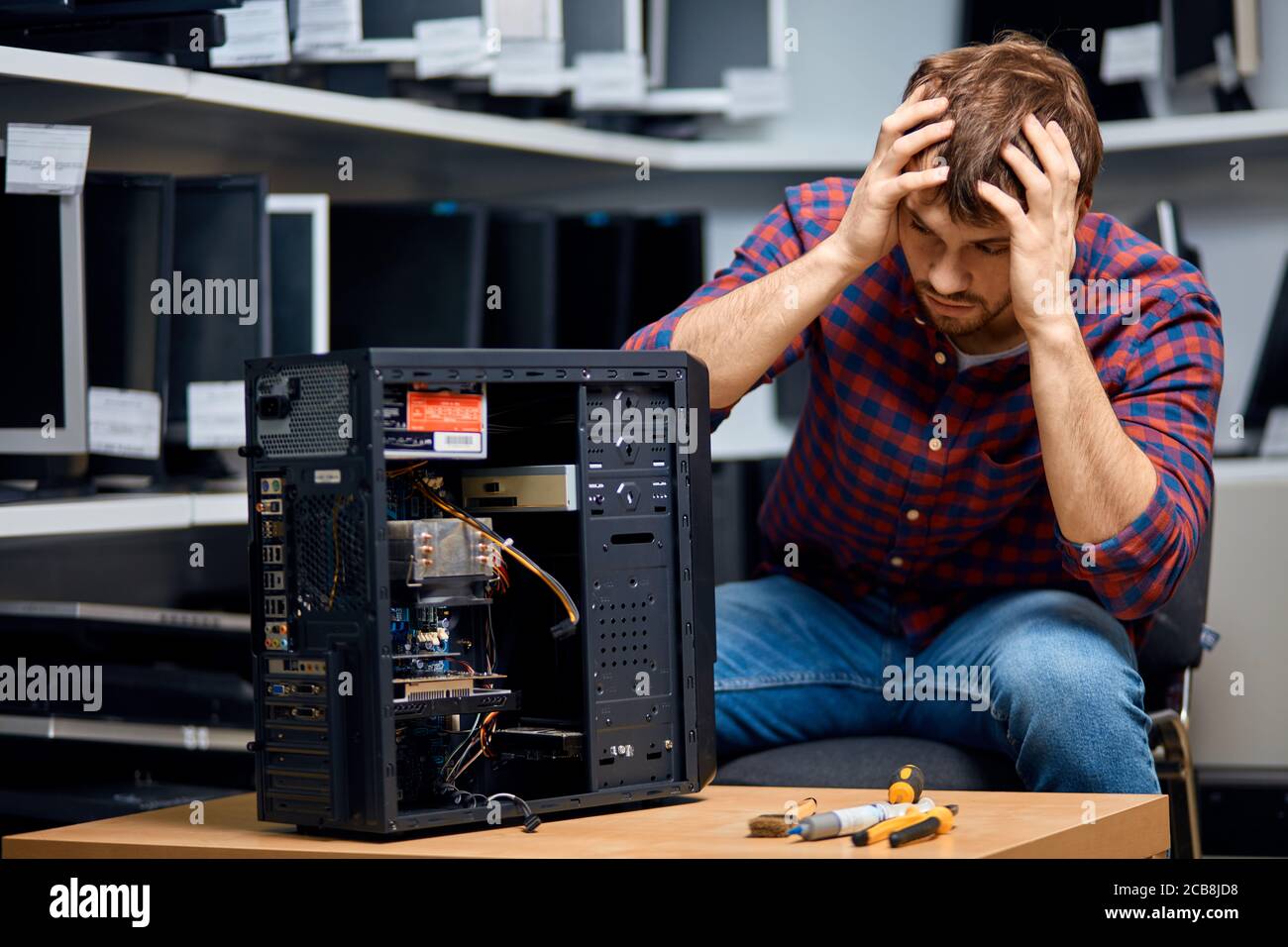 oh, my God.Frustrated young man due to broken system unit.closeup ...