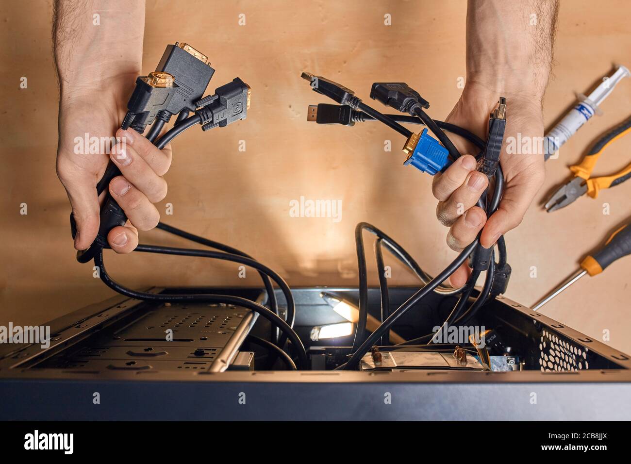 Hand holding device cables hi-res stock photography and images - Alamy