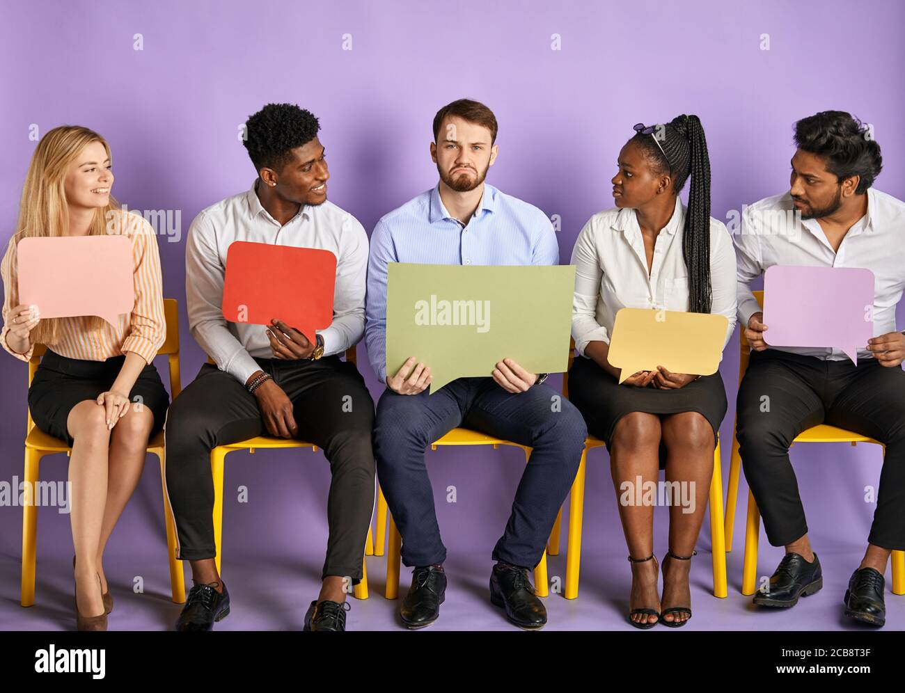 group of young multicultural people sitting with blank thought bubbles ...
