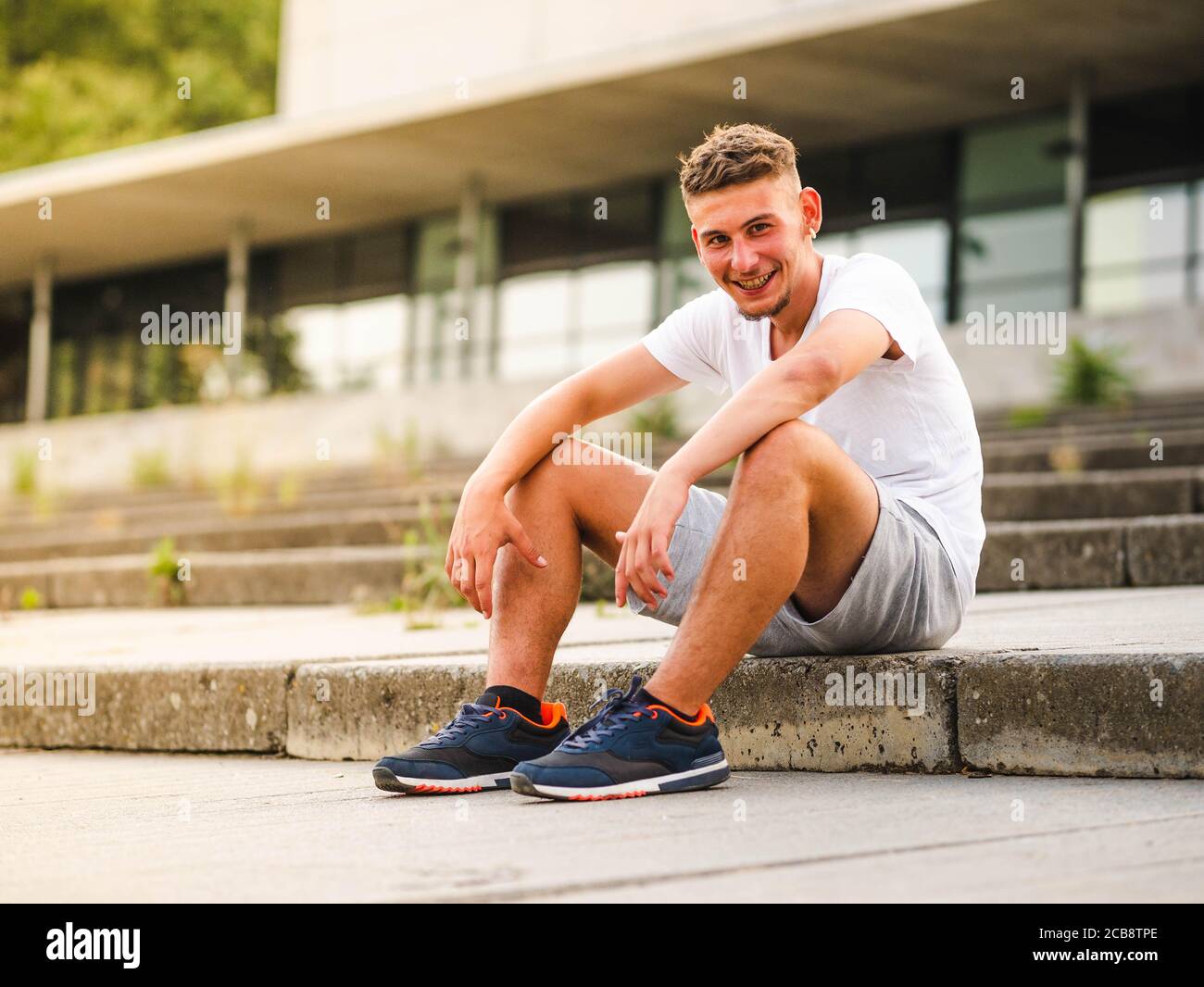 Businessman sitting on stairs hi-res stock photography and images - Alamy