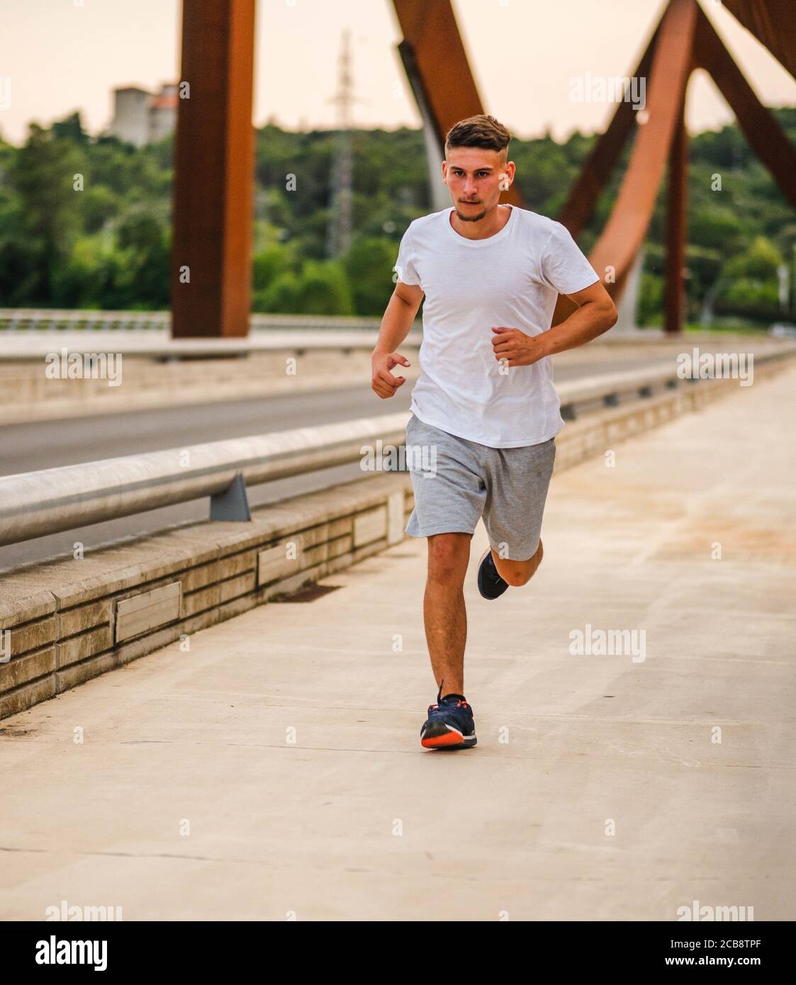 Young attractive sportsman having training outdoors - workout concept ...