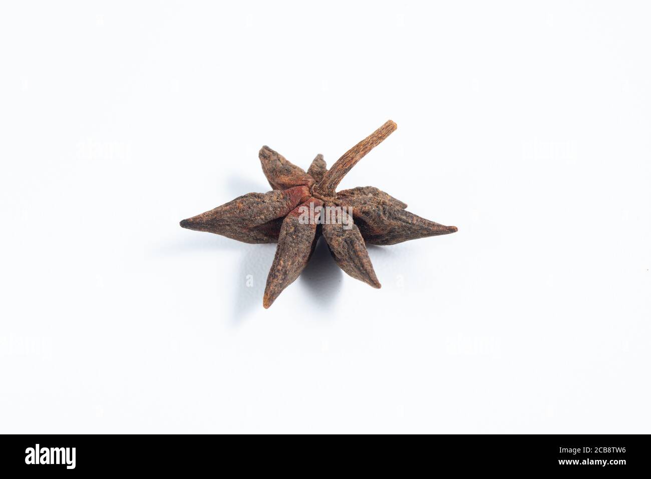 Closeup shot of star anise isolated on white background Stock Photo - Alamy