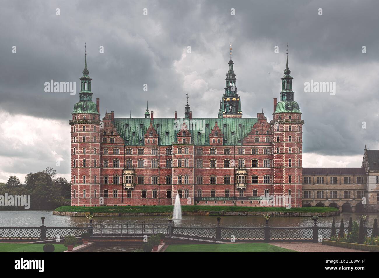 Frederiksborg slot facade view from lake side on background of cloudy ...