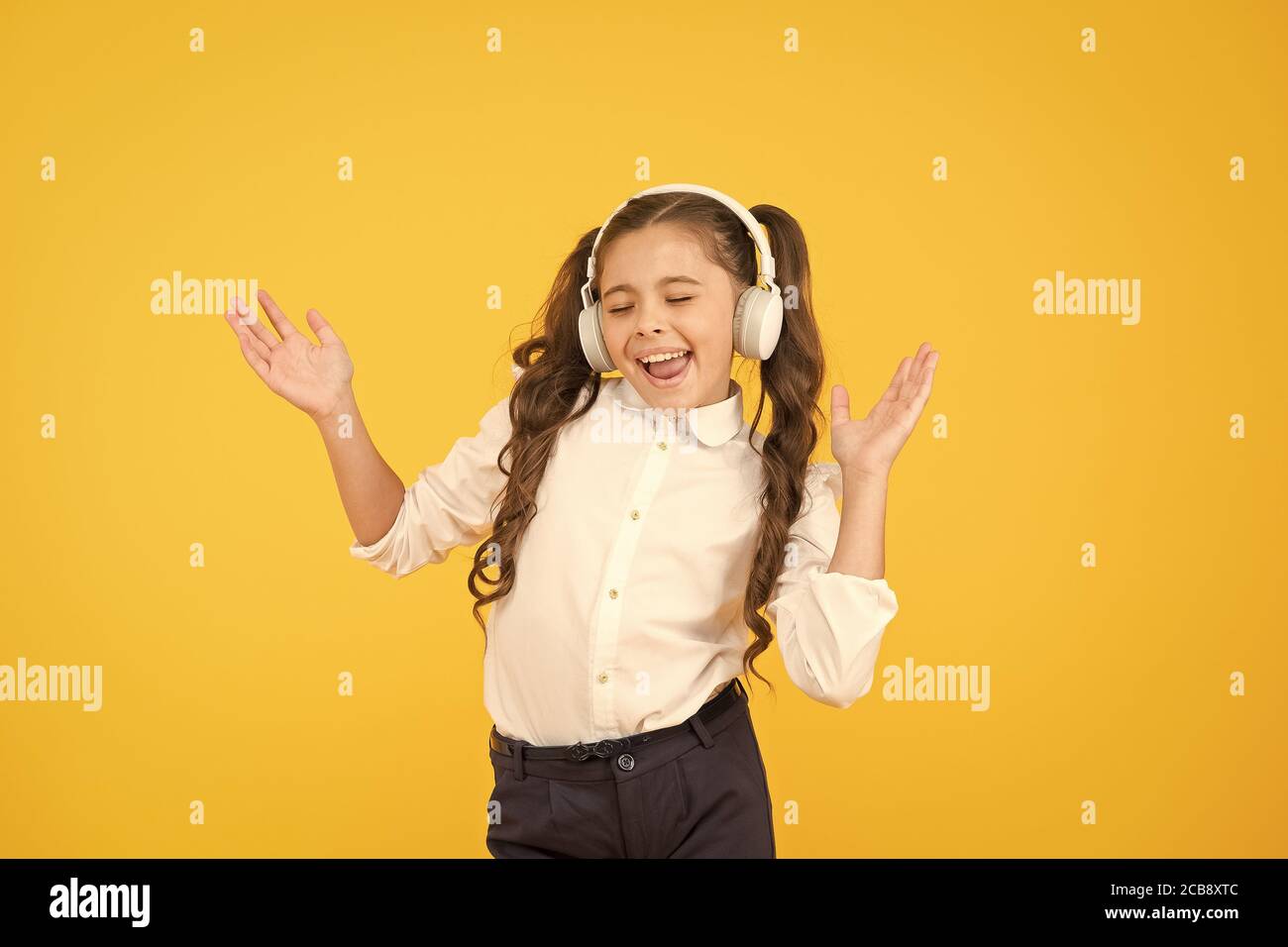 The song clicks with her mood. Adorable little girl singing a song on ...