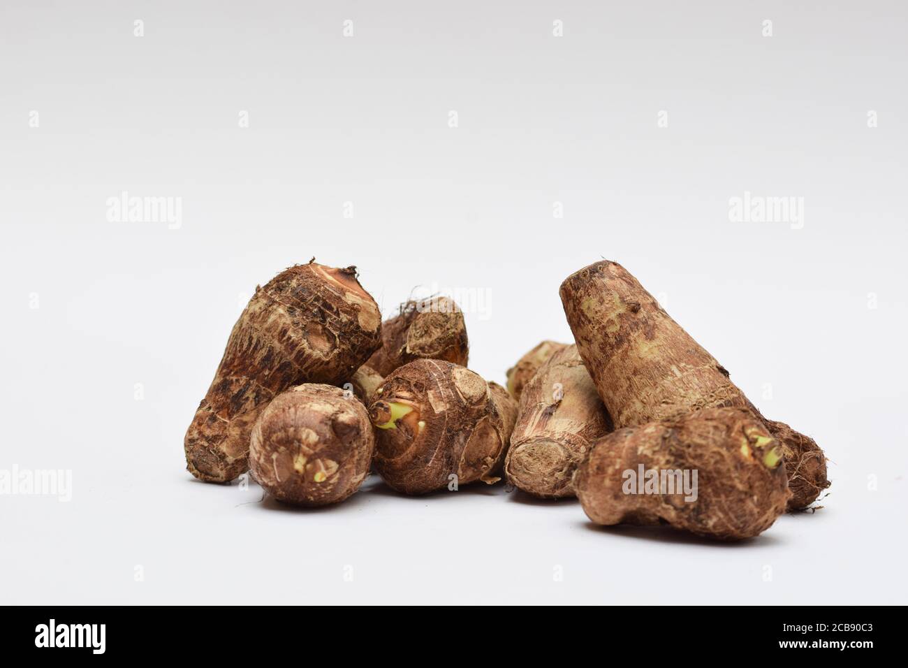 Whole Taro root or Colocasia esculenta raw root vegetable also known as ...