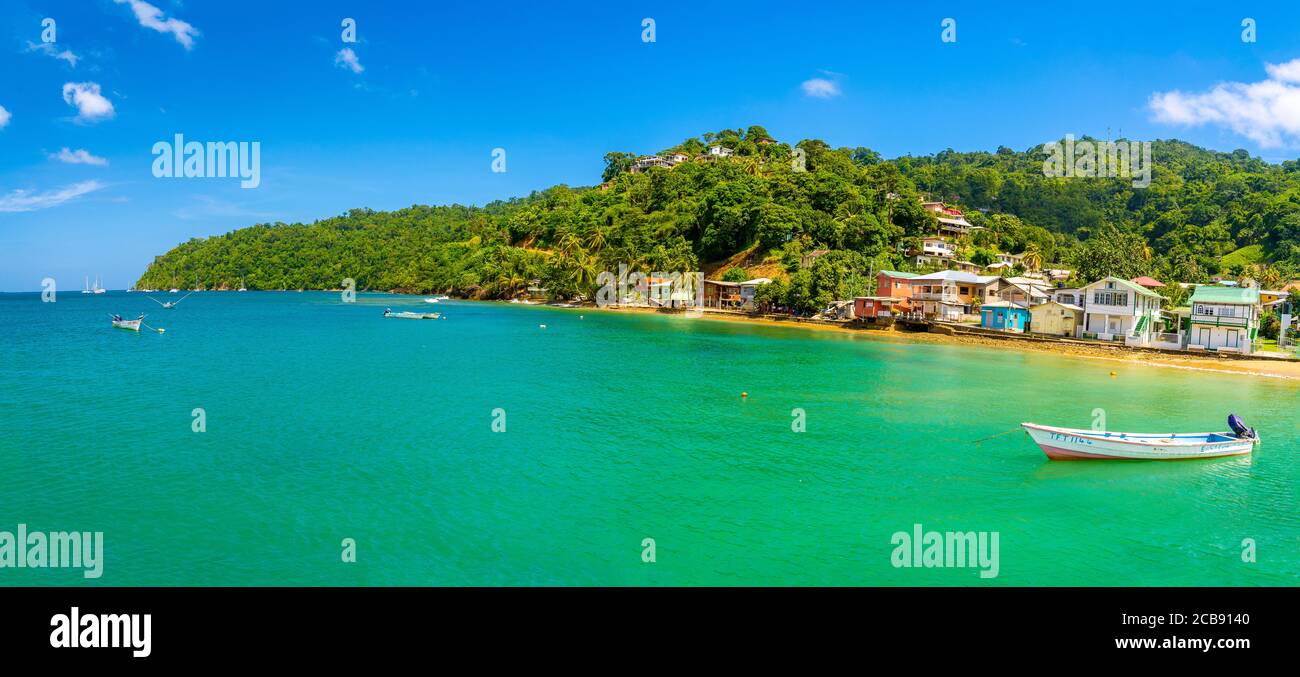 Boats on the ocean gleaming under the blue sky Stock Photo - Alamy