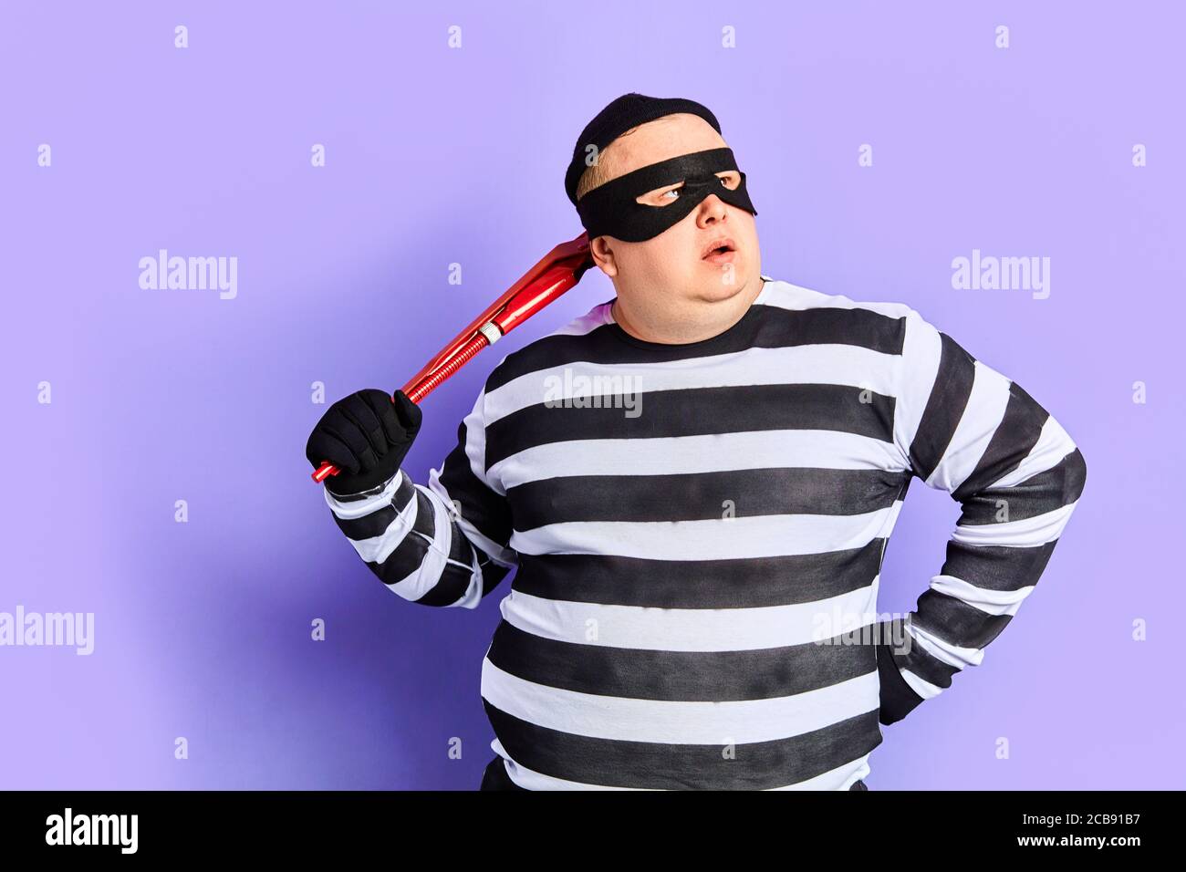 thoughtful prisoner with a tool on his head thinking about new crime ...