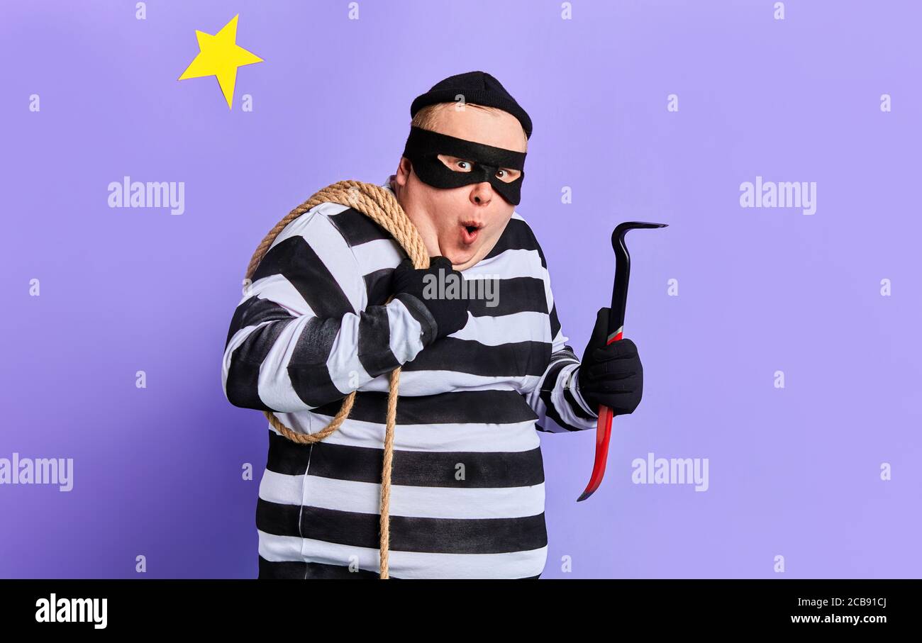 fat plump man with a rope and a crowbar went the house. close up ...