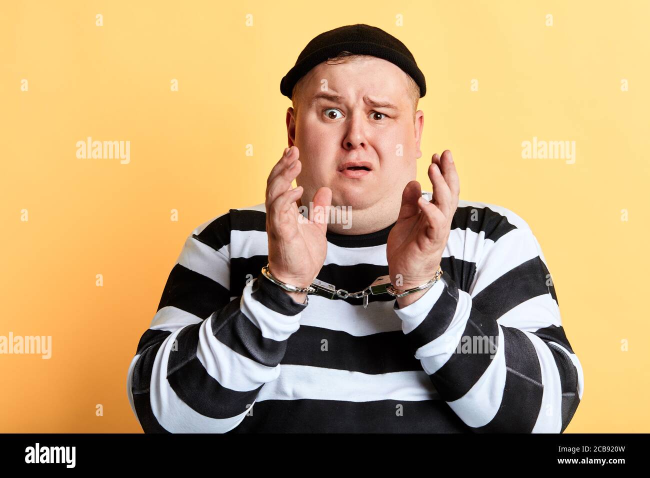 Sad Unhappy Thief Burglar Realizes His Mistake Isolated Yellow Background Feeling And Emotion