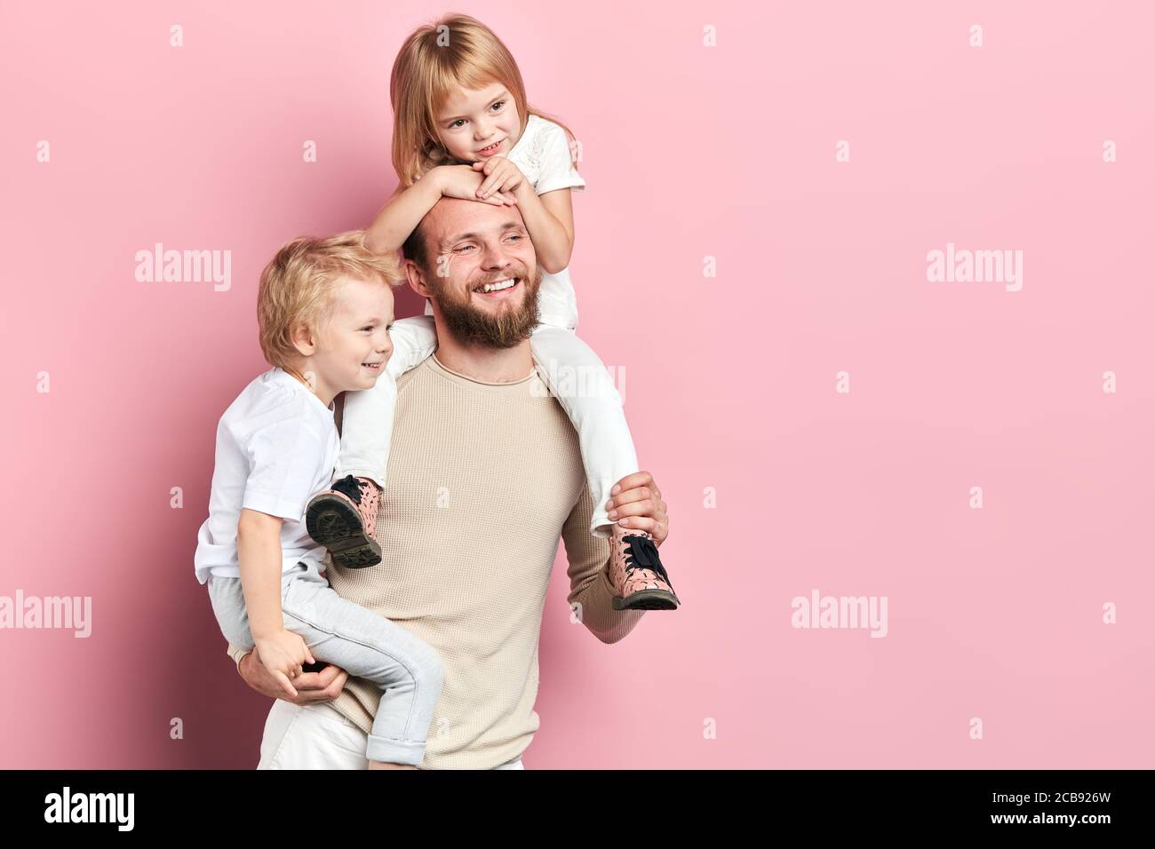 positive daddy and his children laughing at something, expressing ...