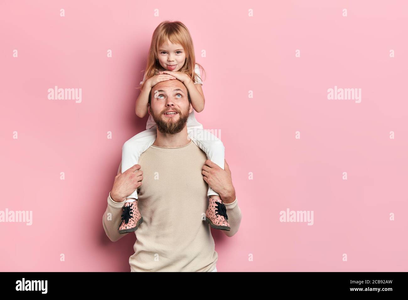 young good looking kind fatherhaving fun with his little child, close ...