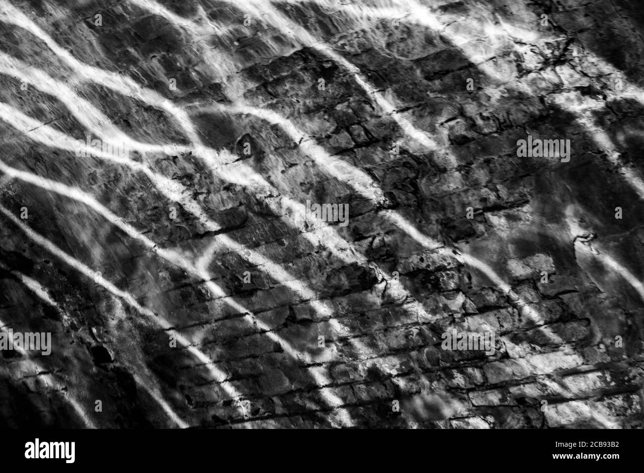 Water drop on surface brick Black and White Stock Photos & Images - Alamy
