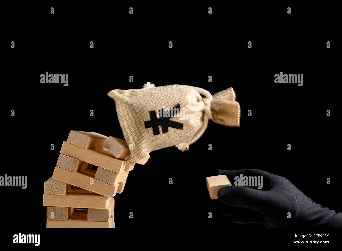 hand with black glove damaging the foundation of a RMB money bag and ...