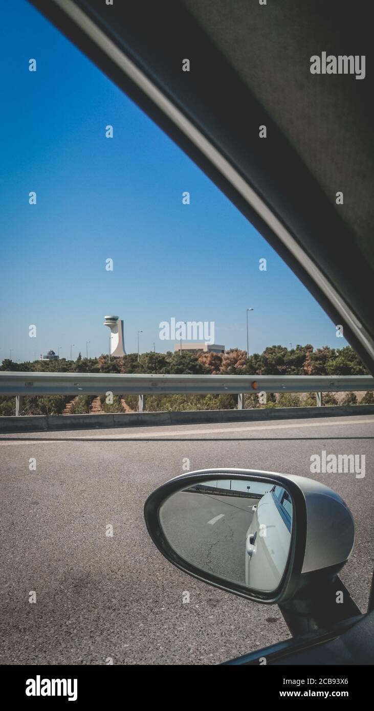 Vertical shot of a car mirror and a highway Stock Photo - Alamy