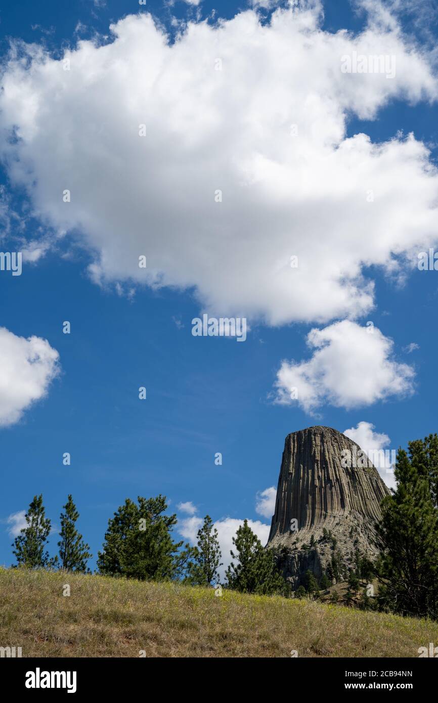 Negative space composition of Devils Tower, with a big blue summer sky ...