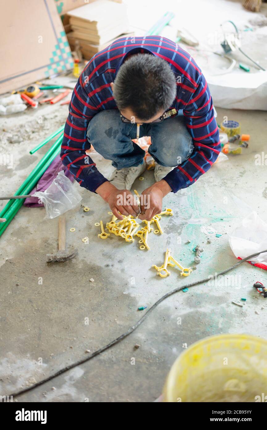construction worker working on interior decoration Stock Photo - Alamy