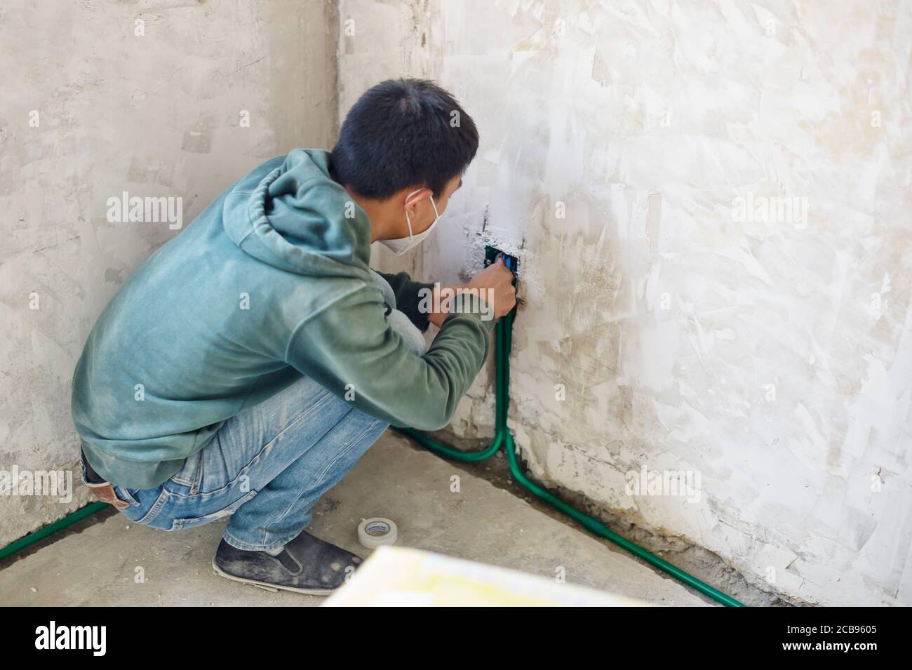 construction worker working on interior decoration Stock Photo - Alamy