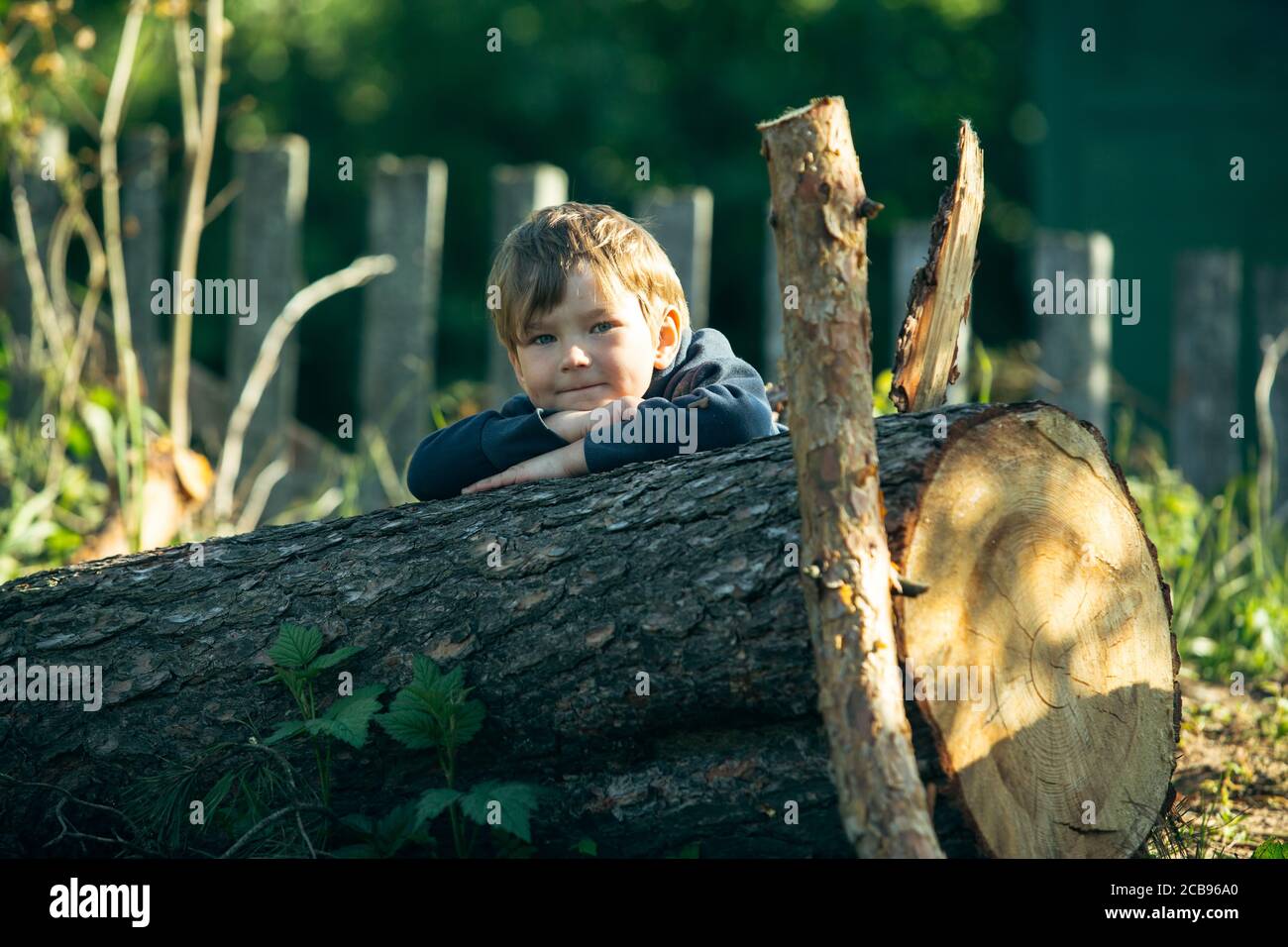 Portrait of cute little boy in the village outdoor Stock Photo - Alamy