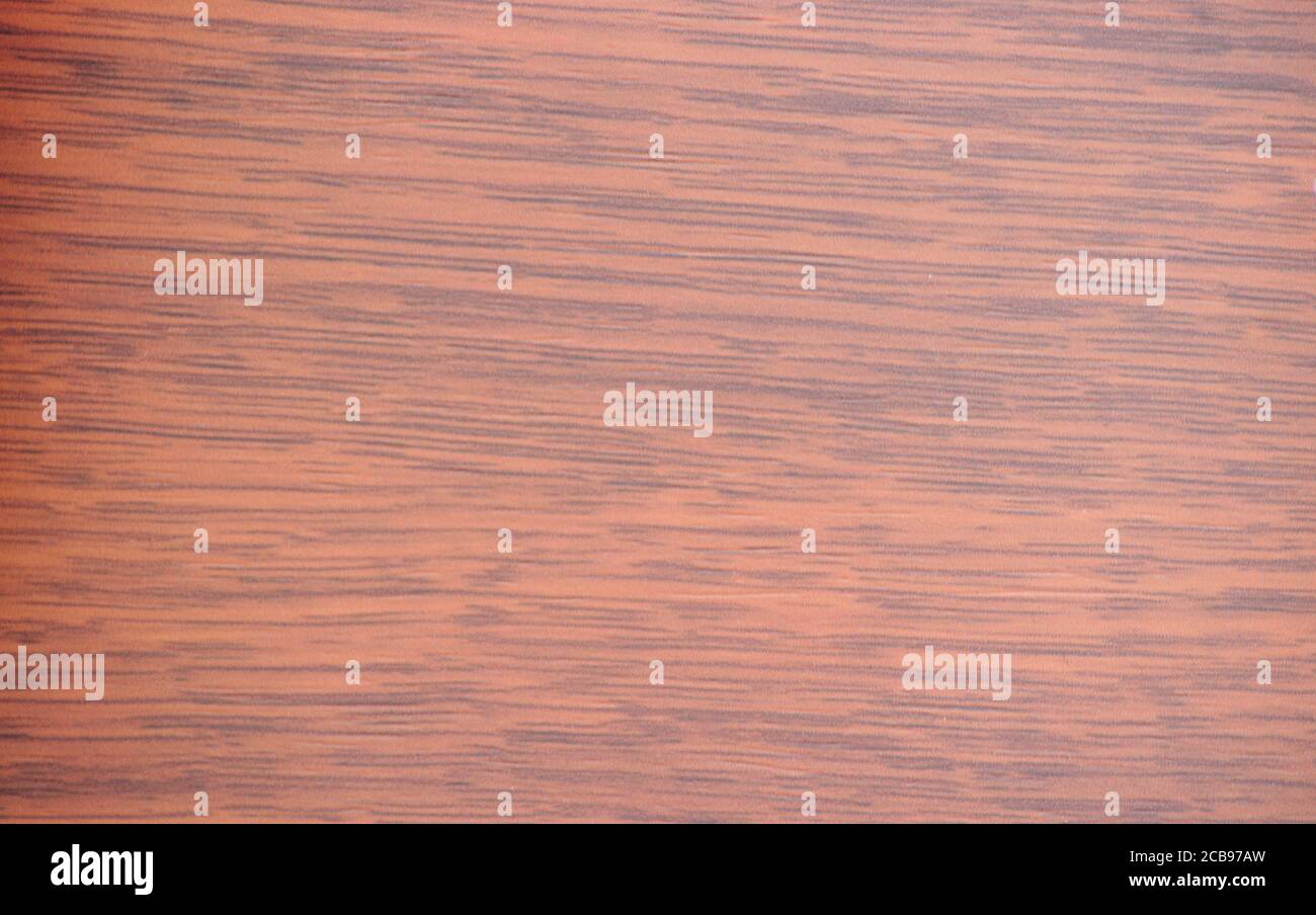 Red cherry, natural wood texture with a rich pattern, close-up ...