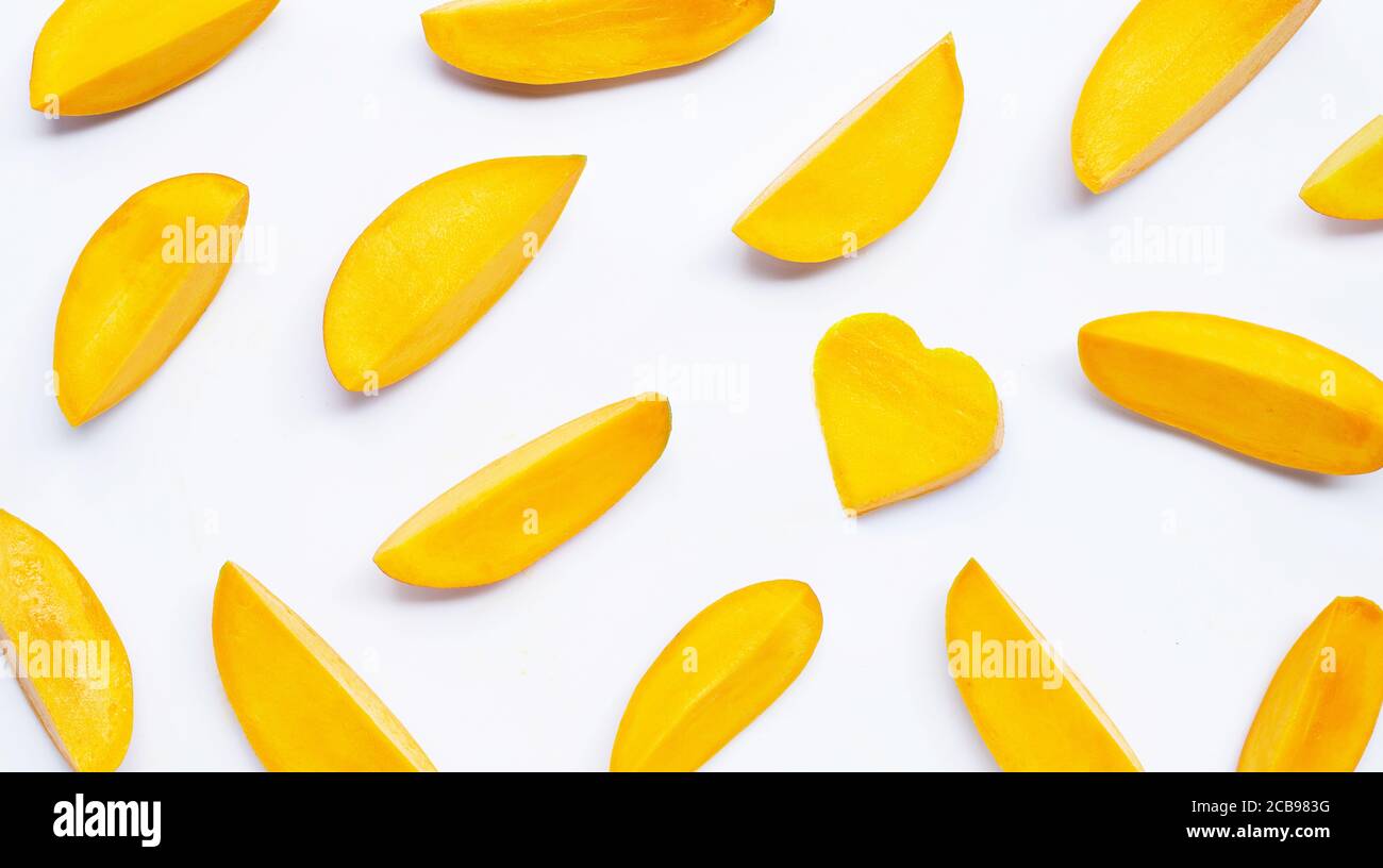 Tropical fruit, Mango slices on white background. Top view Stock Photo ...