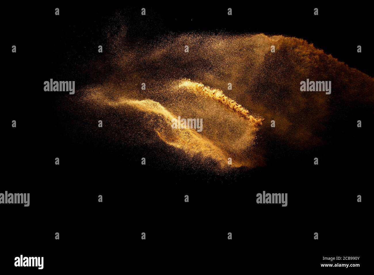 Abstract motion blurred brown color sand splash against black ...