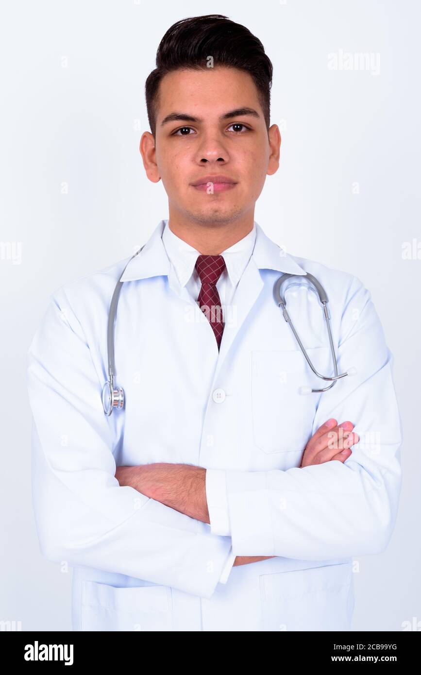 Portrait of young handsome multi ethnic man doctor Stock Photo - Alamy