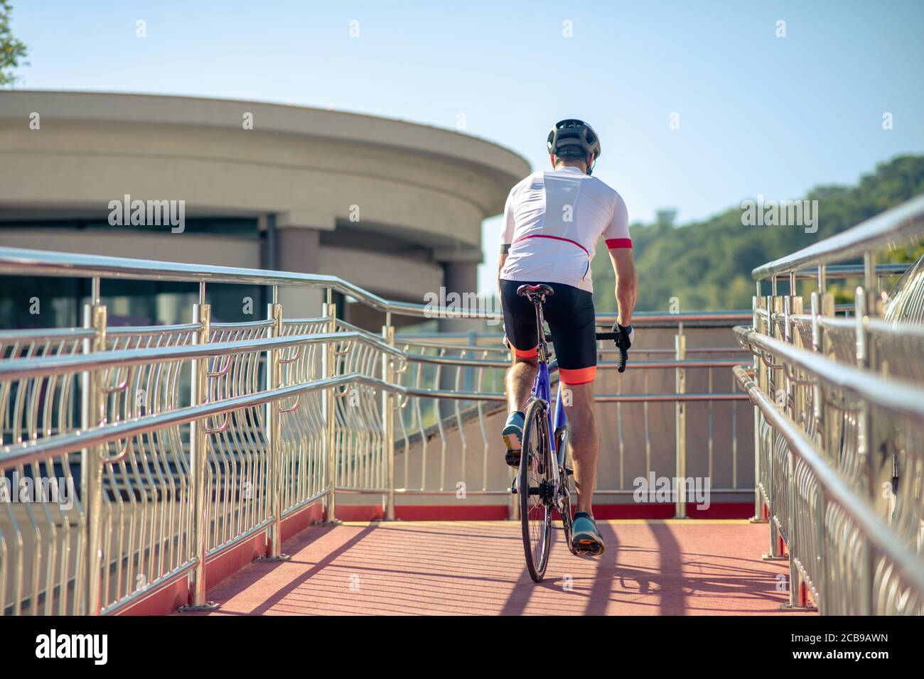 Riding bike on bridge hi-res stock photography and images - Alamy