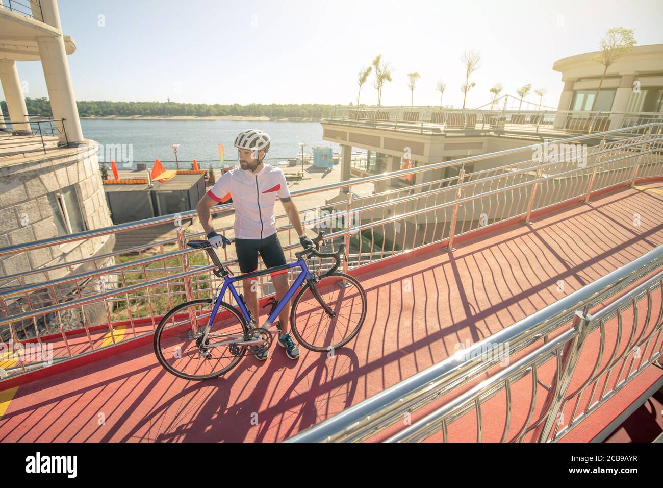 Cyclist standing bridge hi-res stock photography and images - Alamy