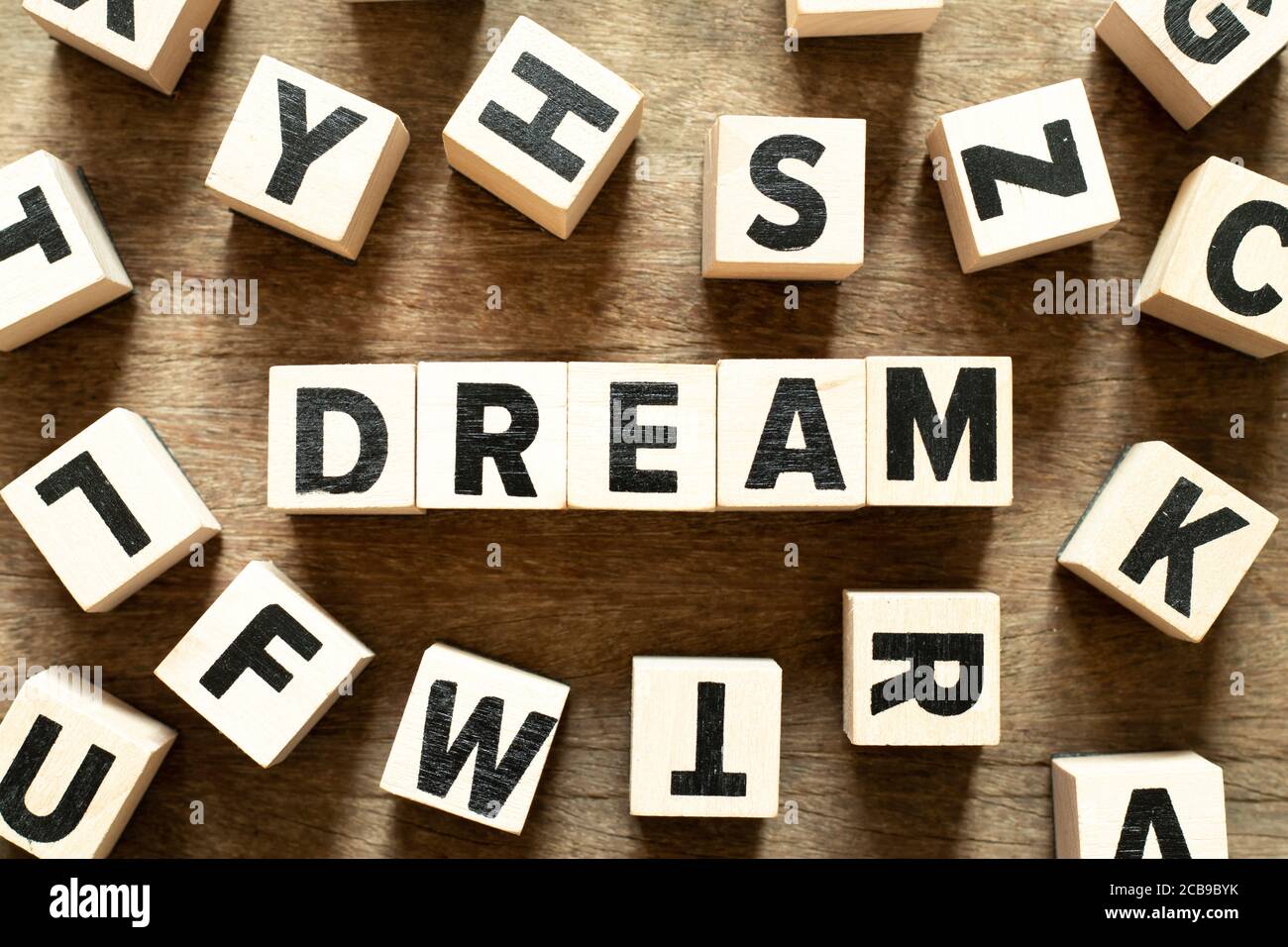 Letter block in word dream with another block on wood background Stock ...