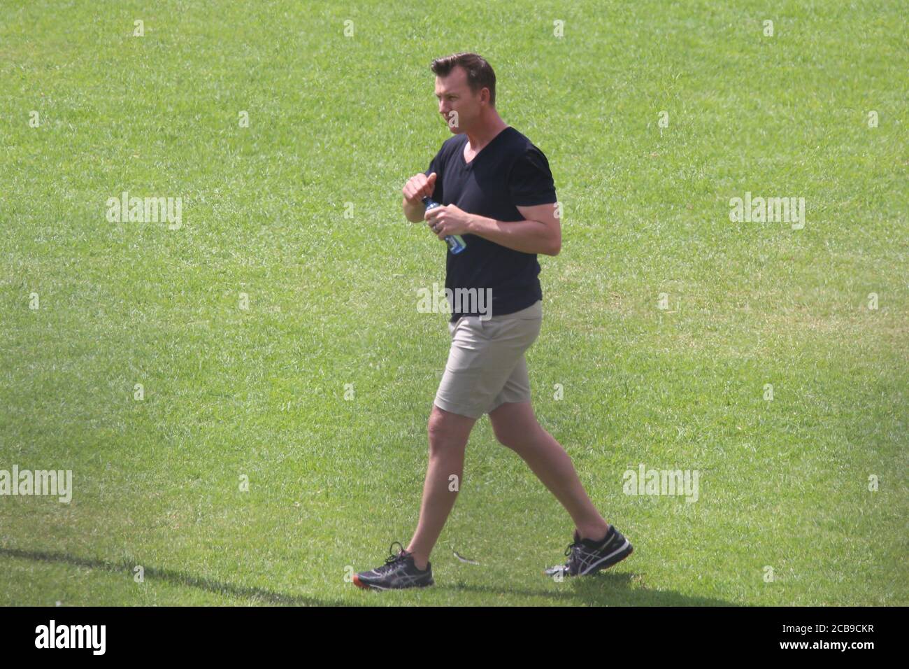 Cricketer Brett Lee filming in Bicentennial Park, Glebe Stock Photo - Alamy