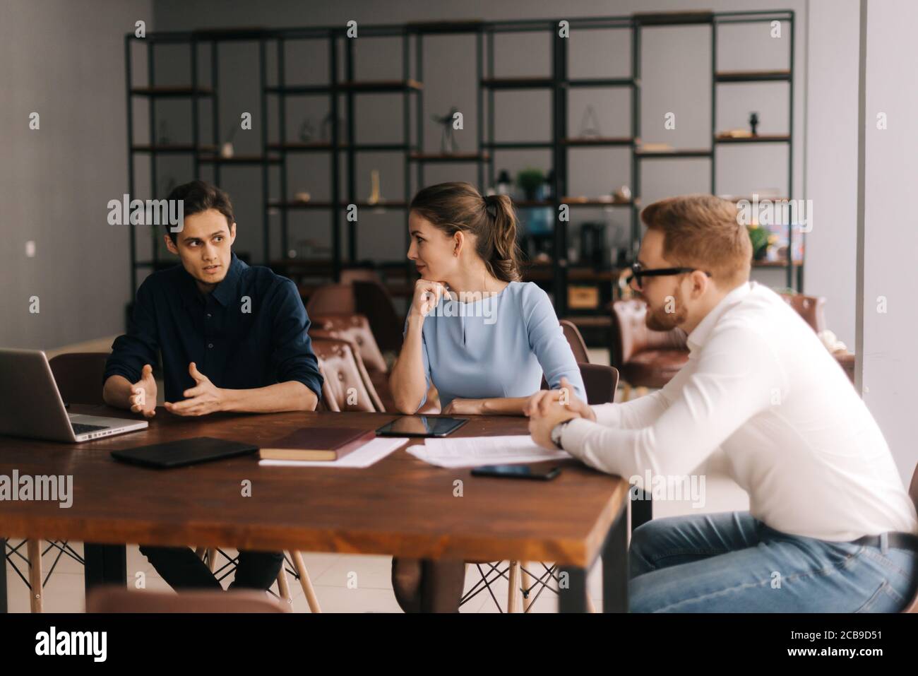 Young happy boss explaining project strategy to executive manager Stock ...