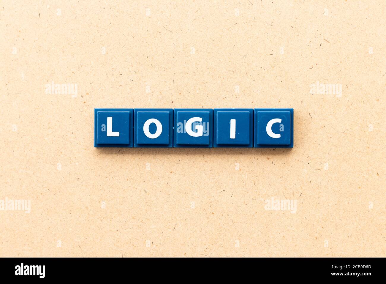 Tile letter in word logic on wood background Stock Photo - Alamy