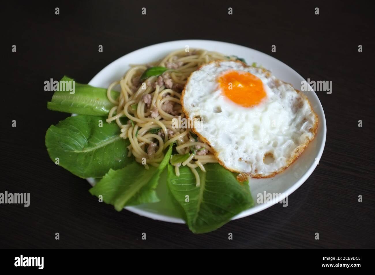 Spaghetti stir fried with Thai Basil spicy sauce with Fried egg ...