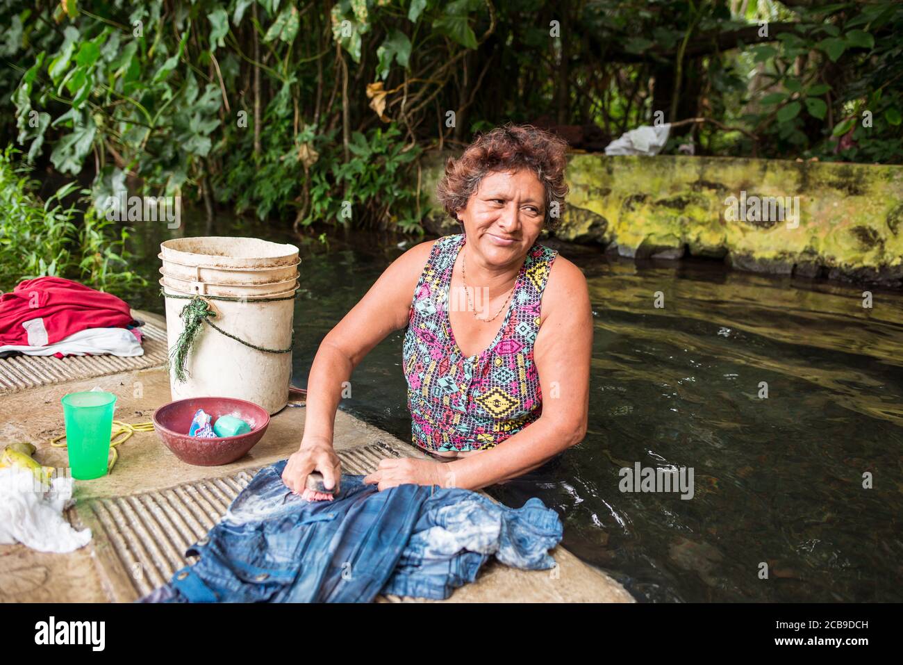 Women hand washing clothes hi-res stock photography and images - Alamy
