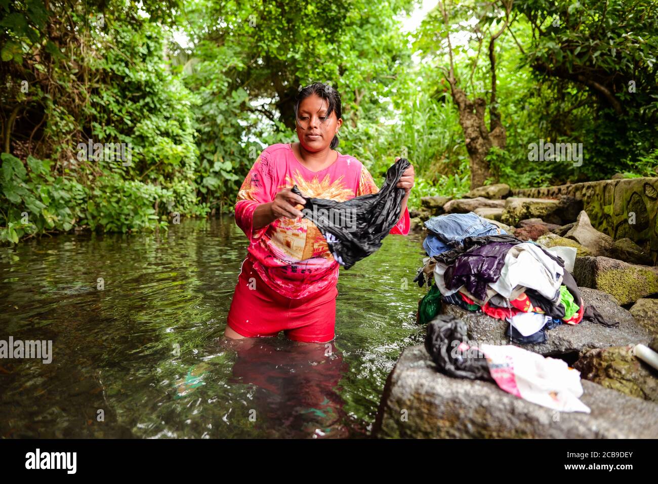 Women hand washing clothes hi-res stock photography and images - Alamy