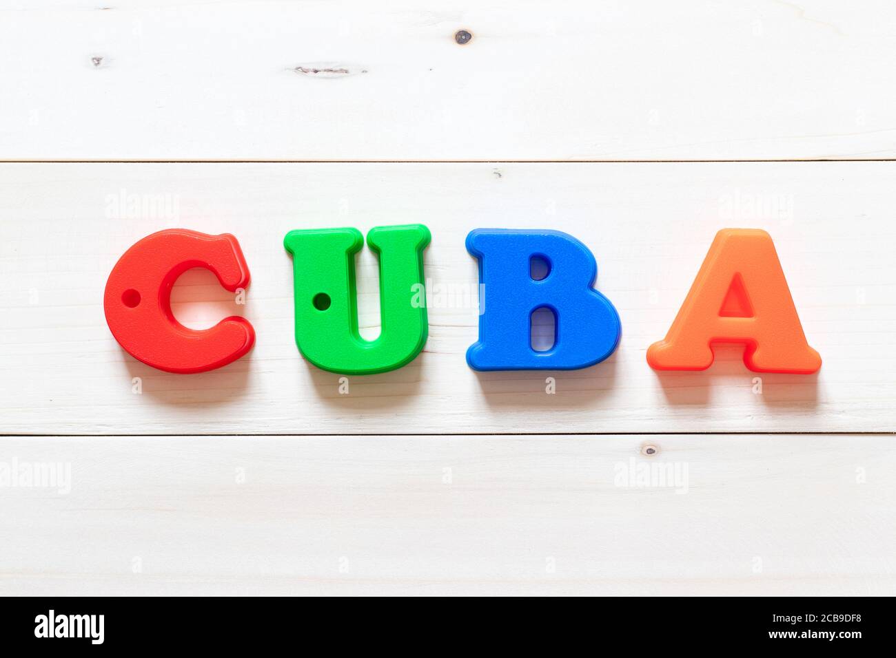 Letter block in word Cuba on white wood background Stock Photo - Alamy