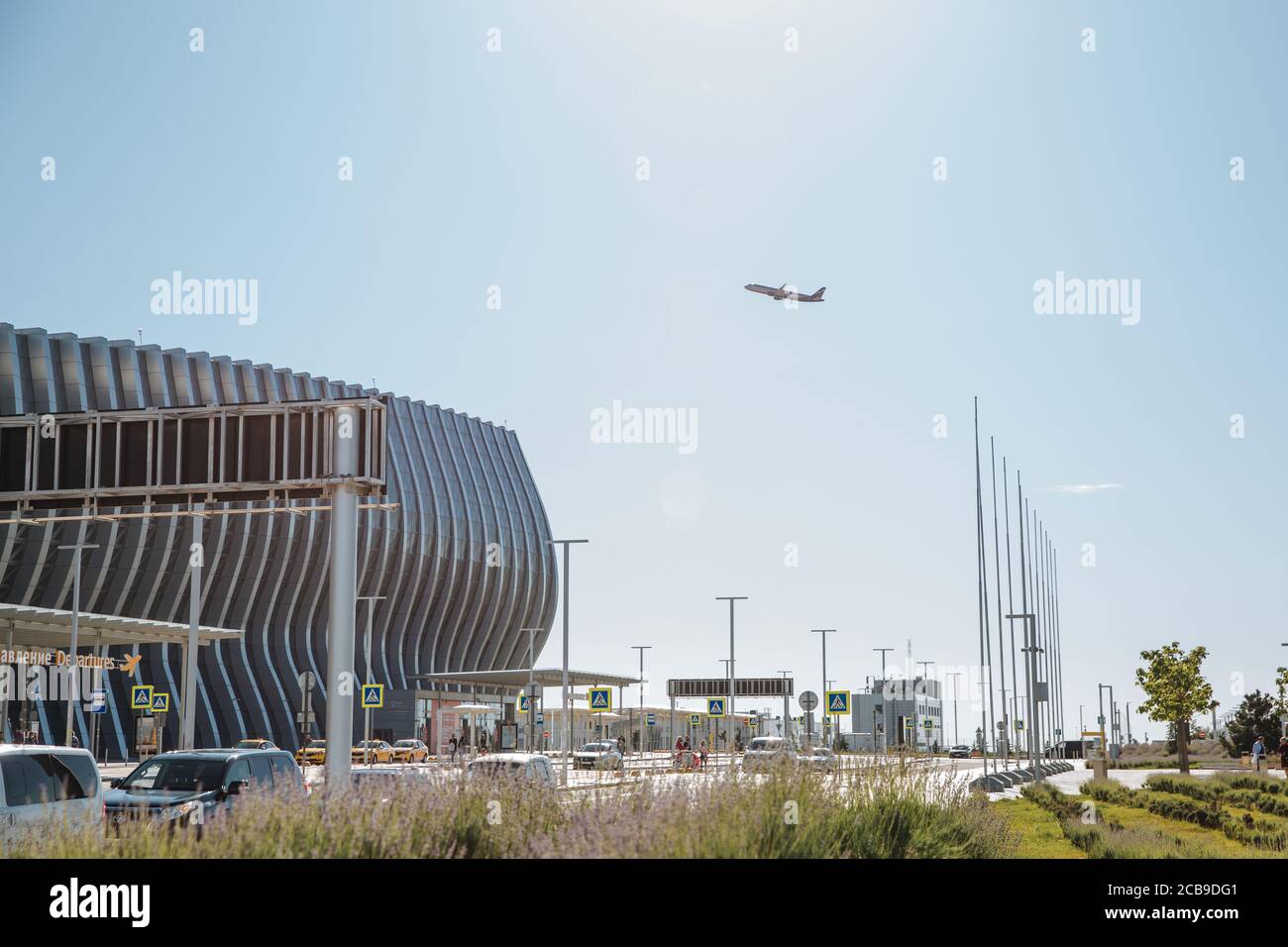 The plane is in takeoff mode. Side view. The plane flies against the ...