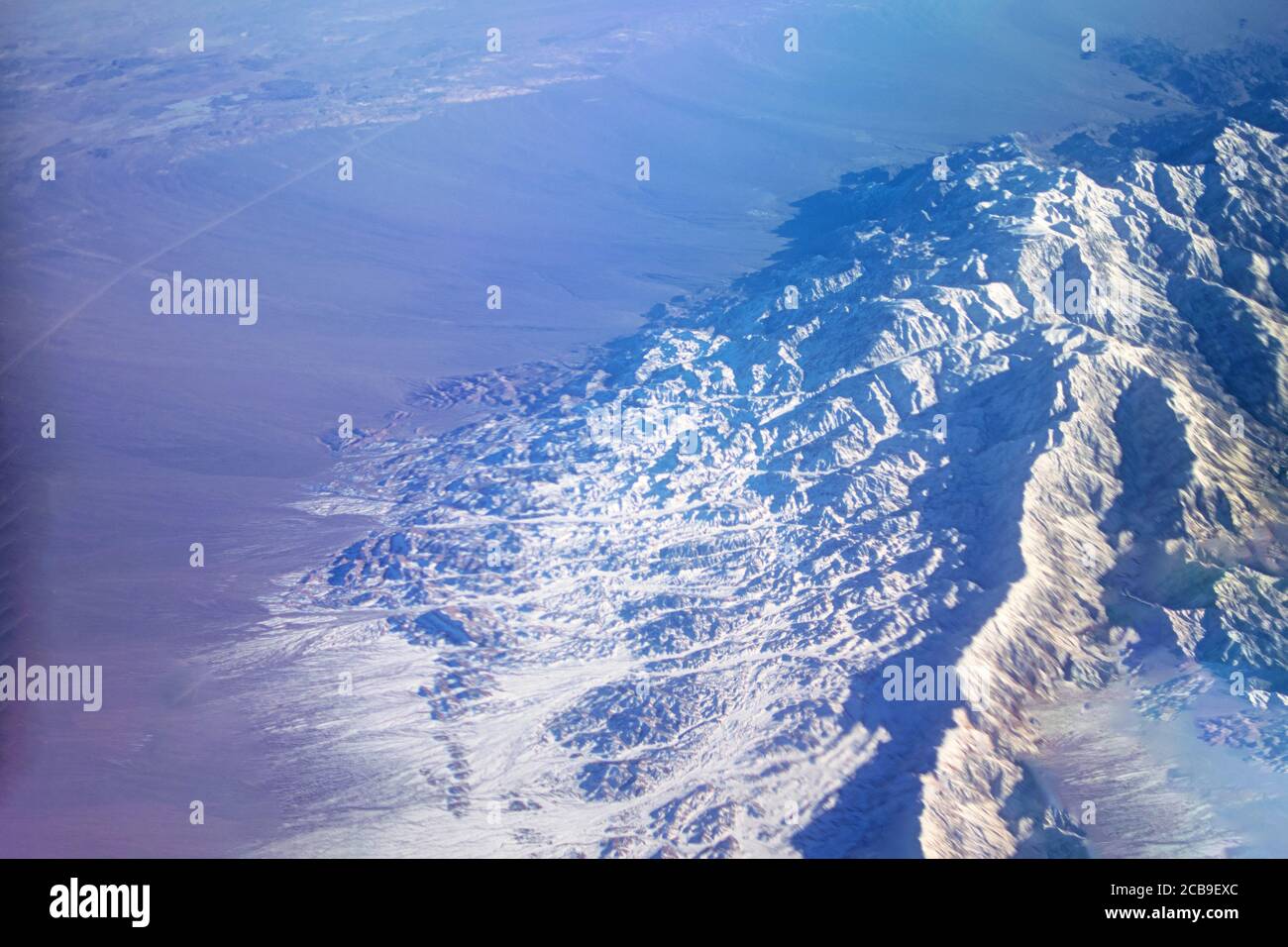 Beautiful winter mountains from the plane window Stock Photo - Alamy