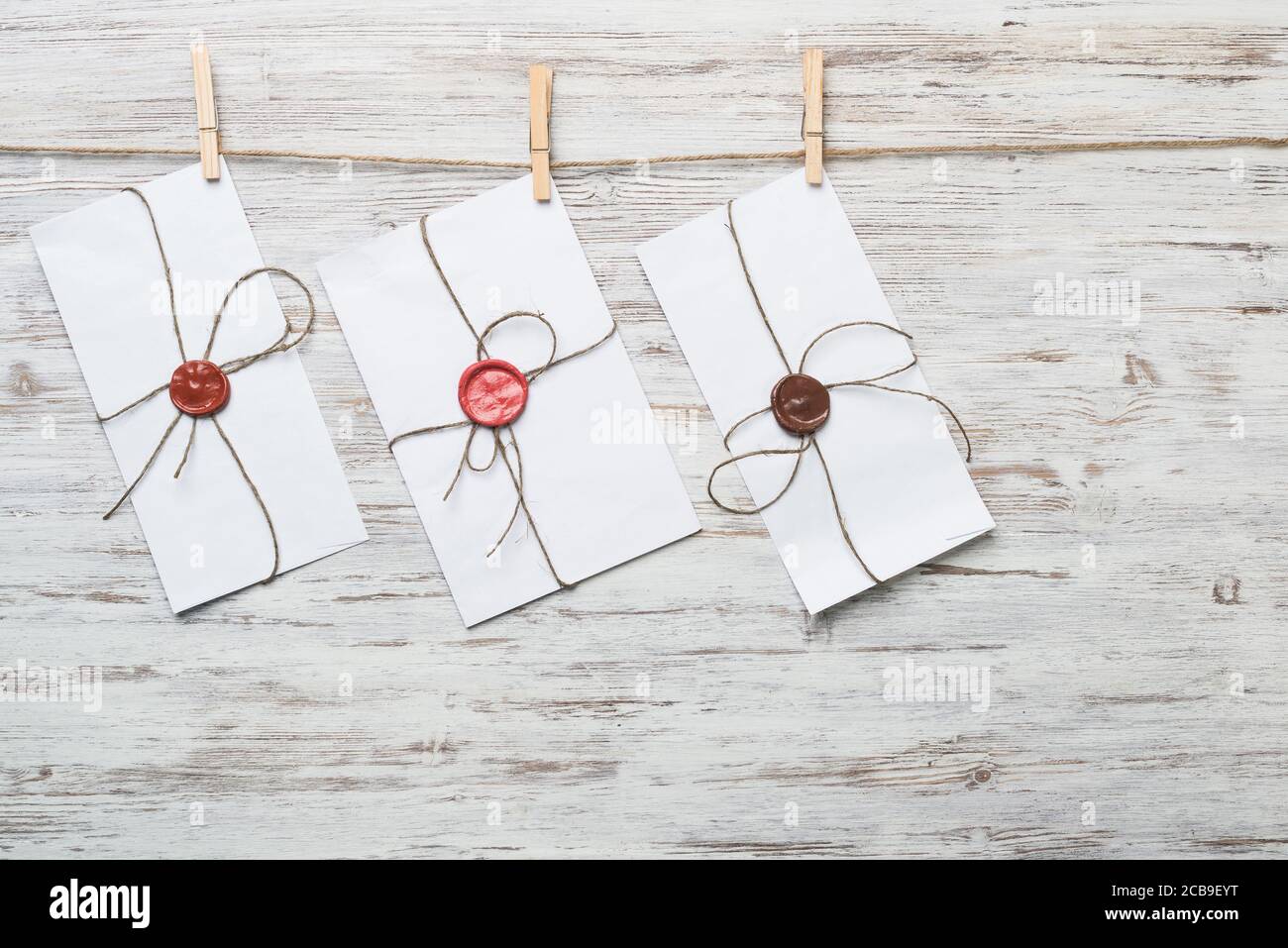Mail envelope on rope Stock Photo - Alamy