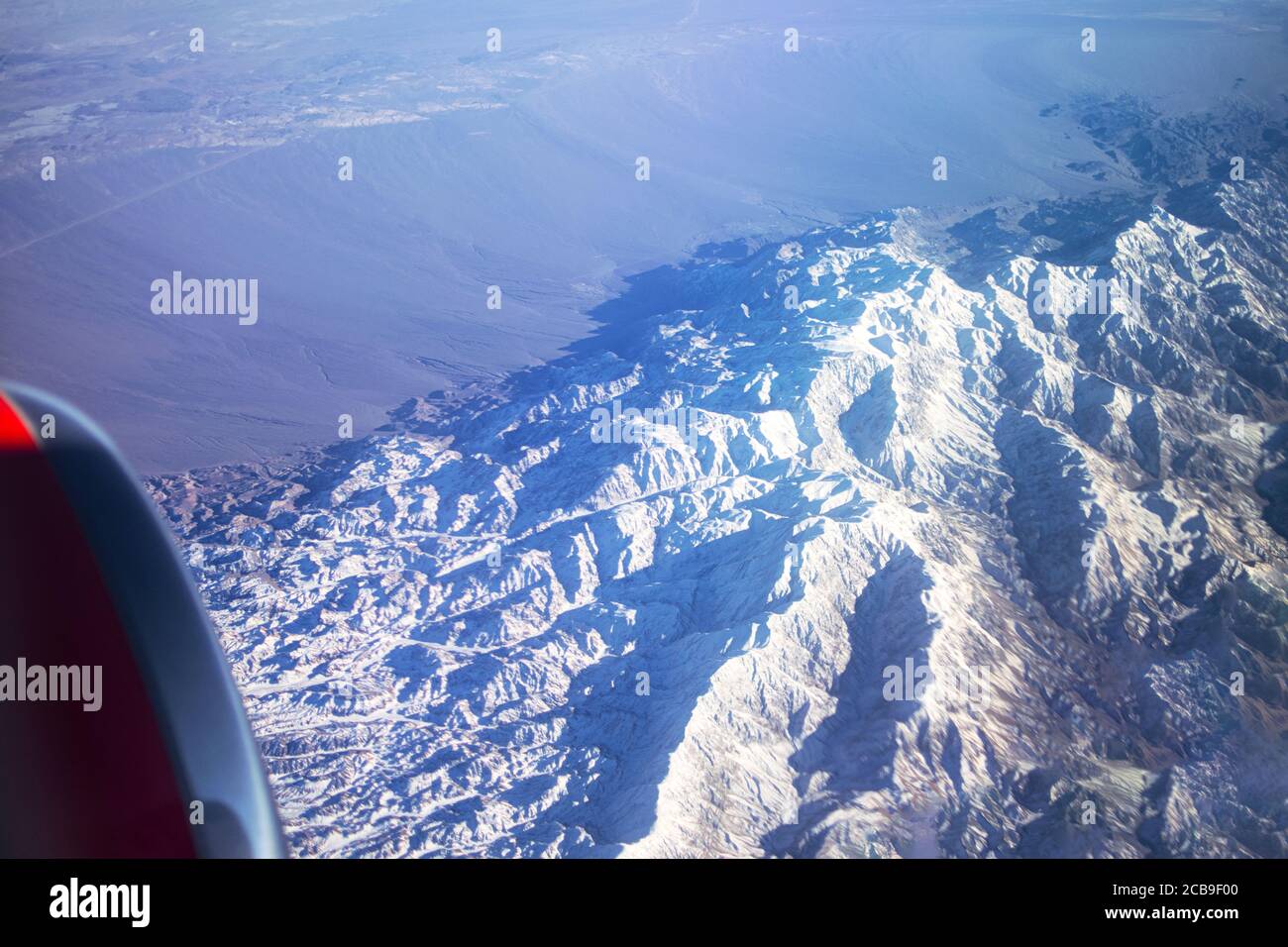 Beautiful winter mountains from the plane window Stock Photo - Alamy