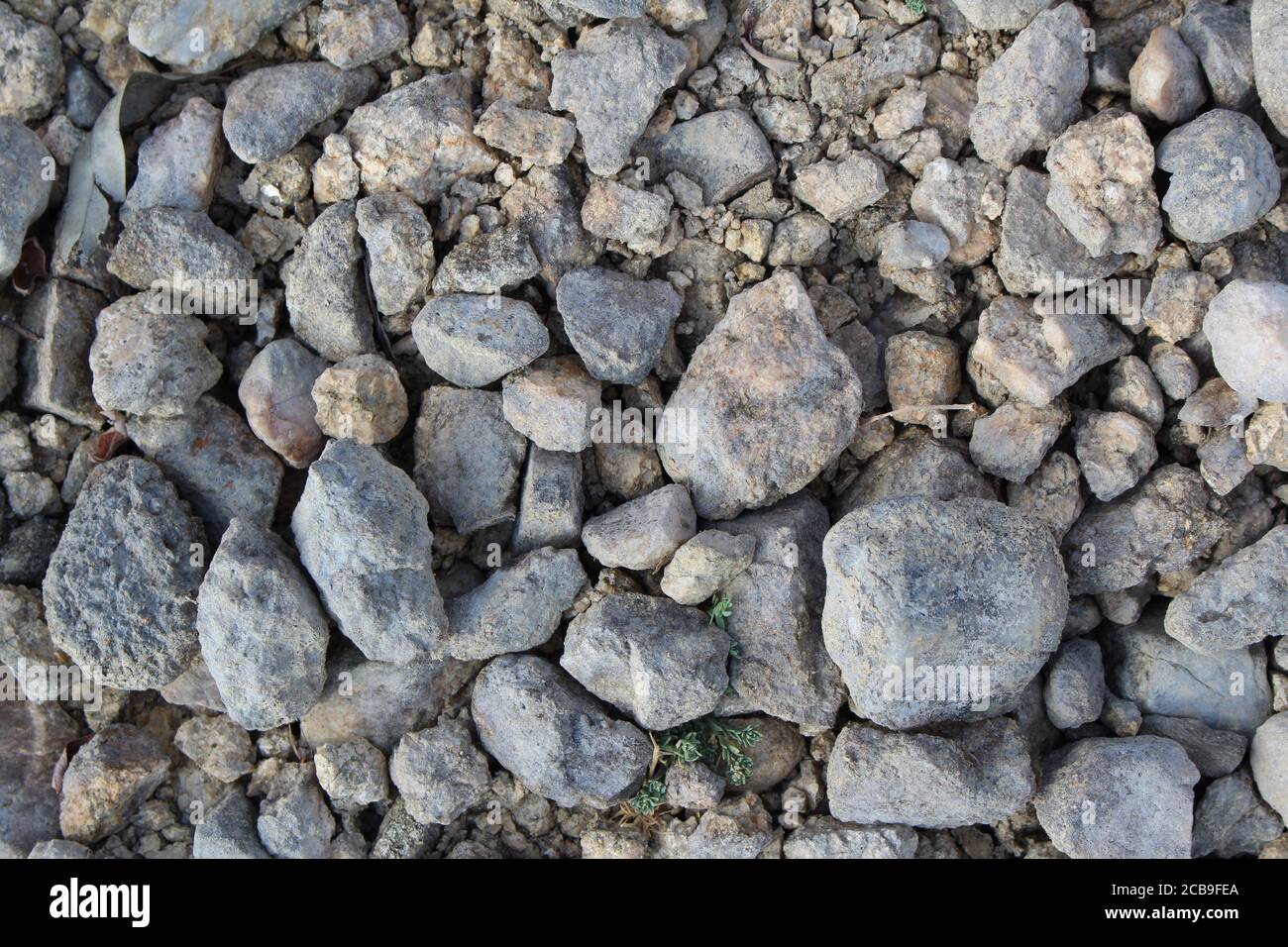 Closeup shot stones on boulders roads Stock Photo - Alamy