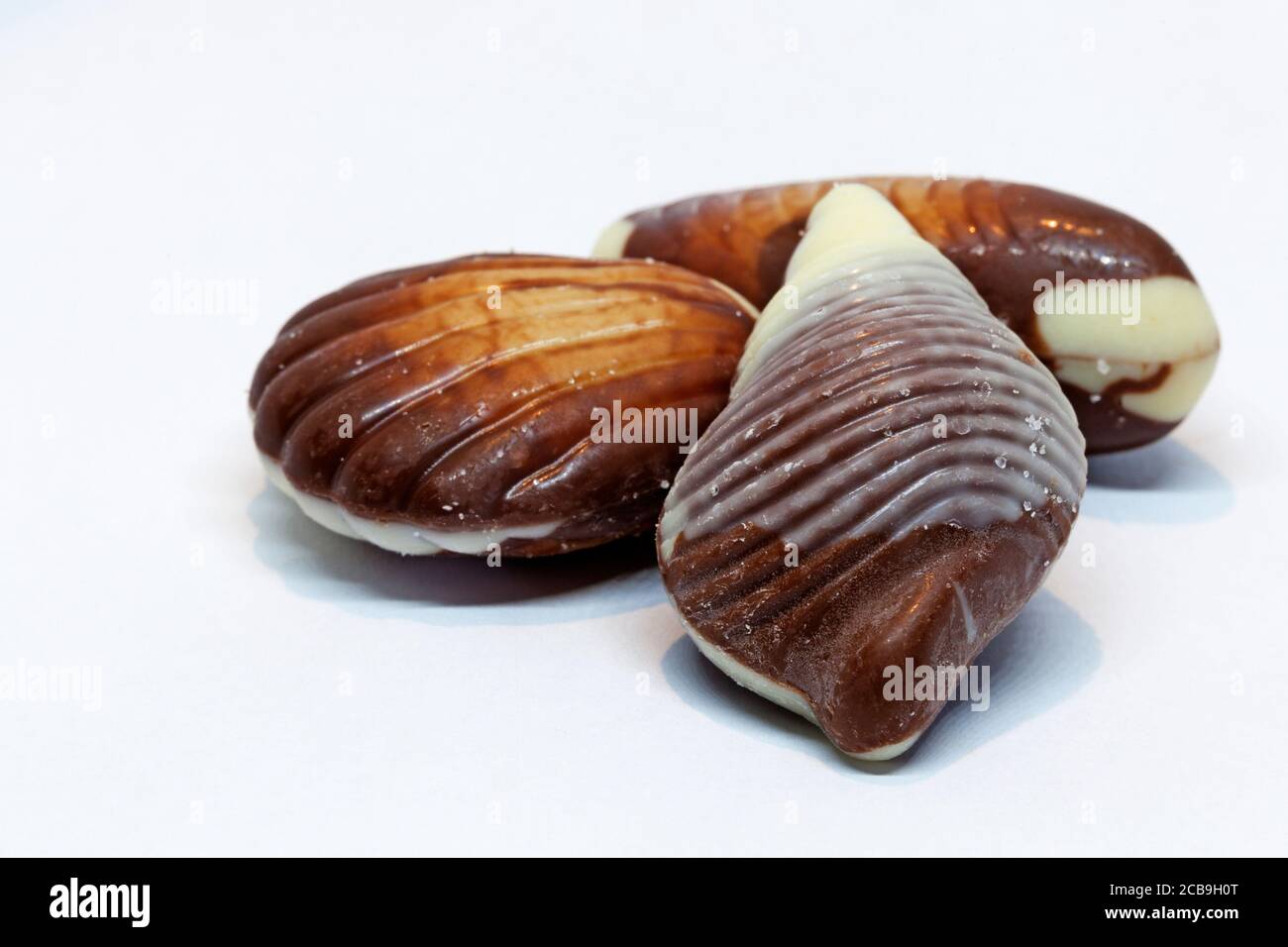 three shells with different shapes made of chocolate Stock Photo - Alamy
