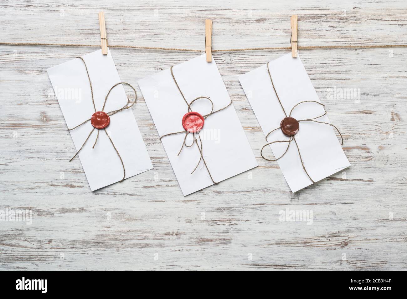 Mail envelope on rope Stock Photo - Alamy