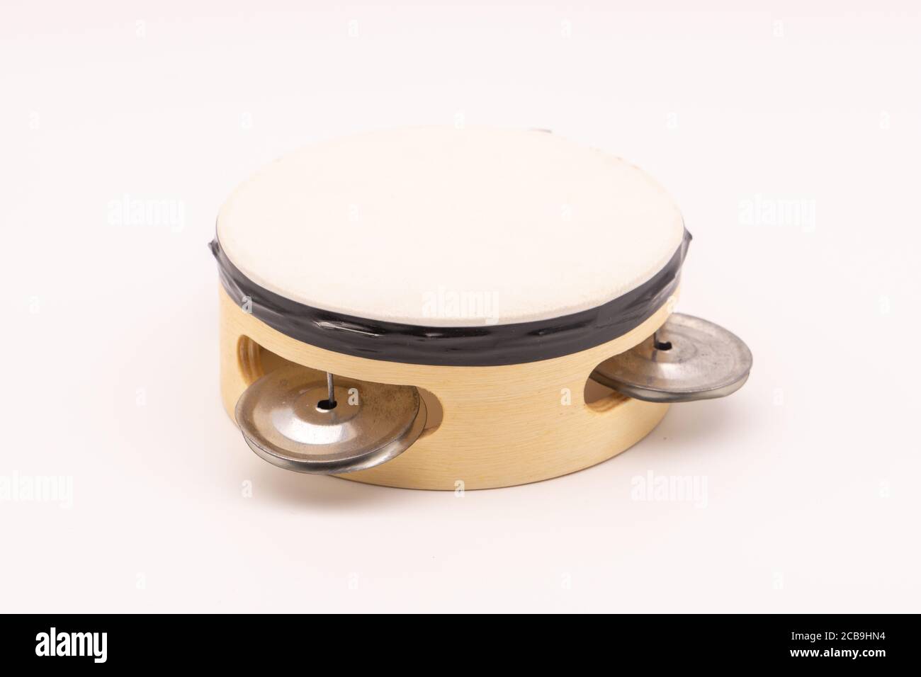 mini pandero with white background Stock Photo - Alamy