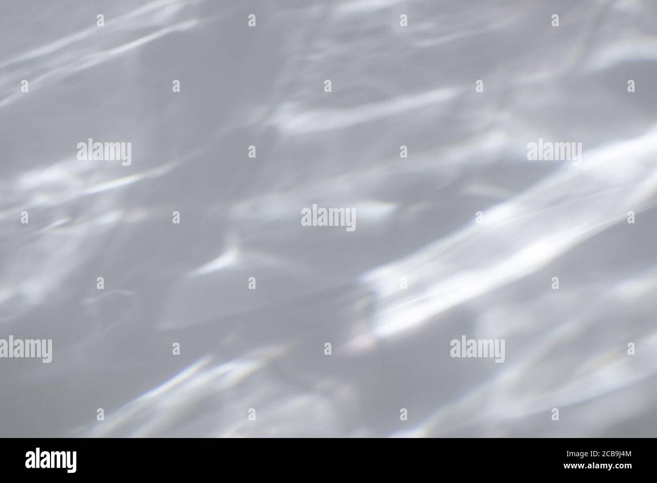 shadow and light caustic effect on a white wall Stock Photo - Alamy