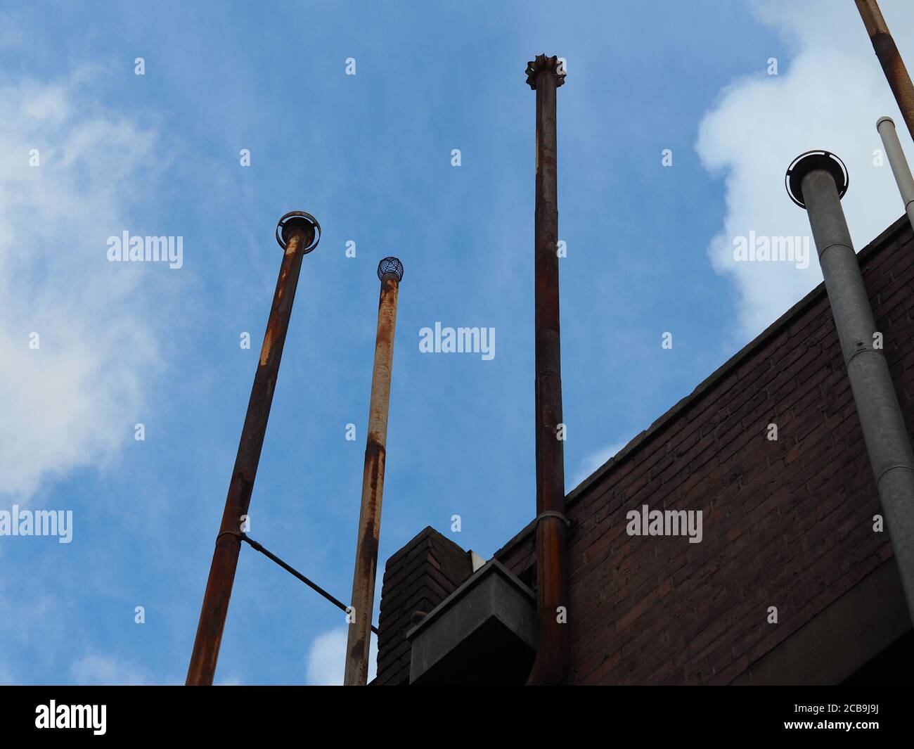 Building with brick chimneys hi-res stock photography and images - Alamy