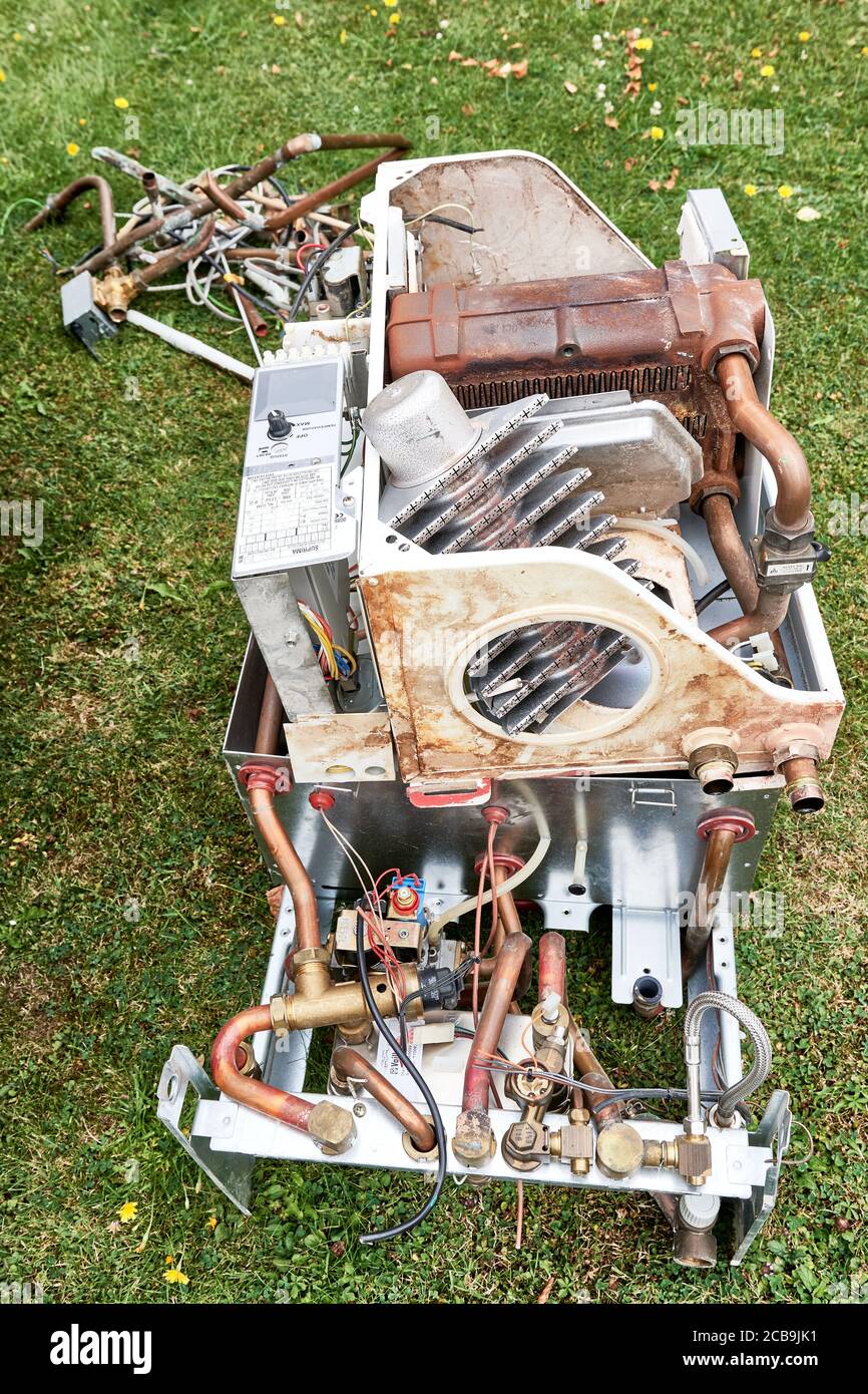 Disused water boiler waits for recycling Stock Photo - Alamy